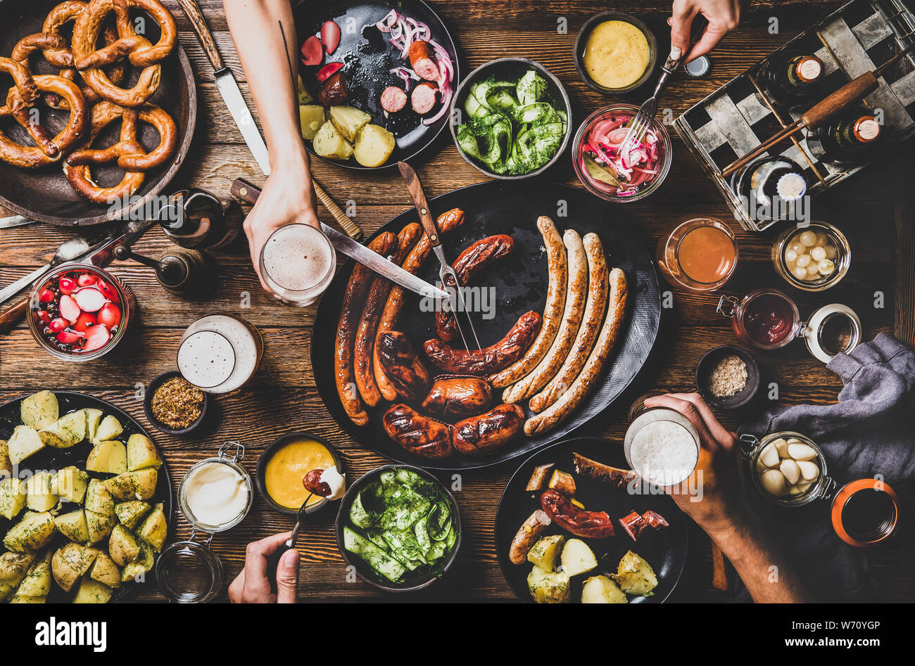 Flat-lay of Octoberfest dinner table concept with grilled sausages ...