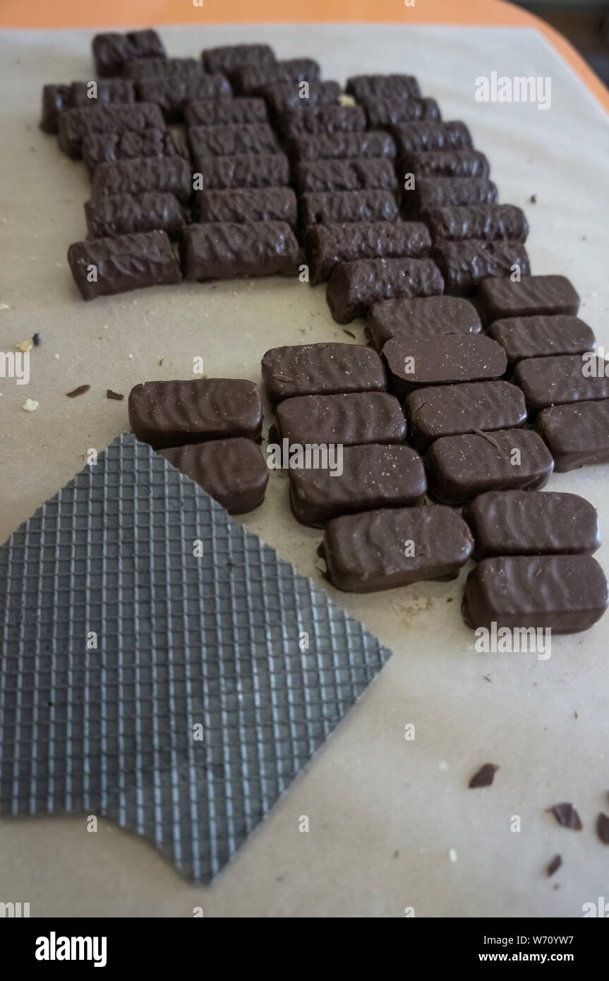 Chocolate, wafer sweets and black wafer sheet in chocolate production ...
