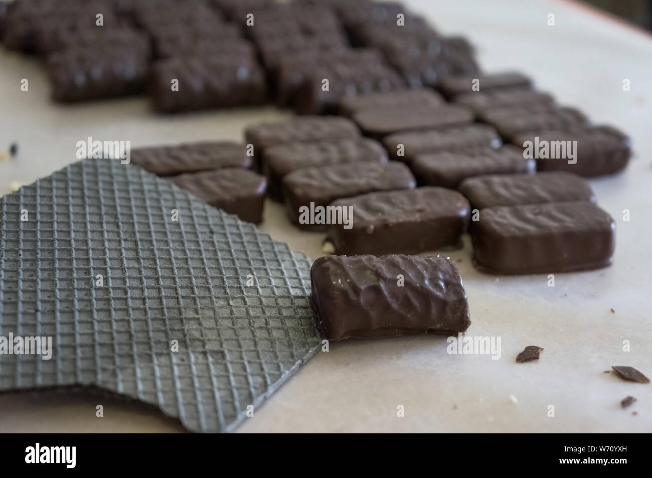 Chocolate, wafer sweets and black wafer sheet in chocolate production ...