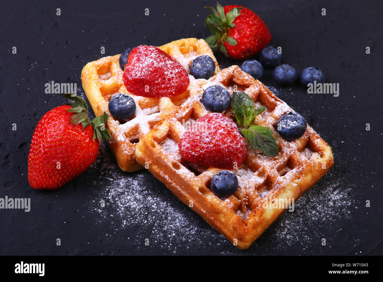 Homemade Traditional belgian waffles with fresh fruit, berries and ...