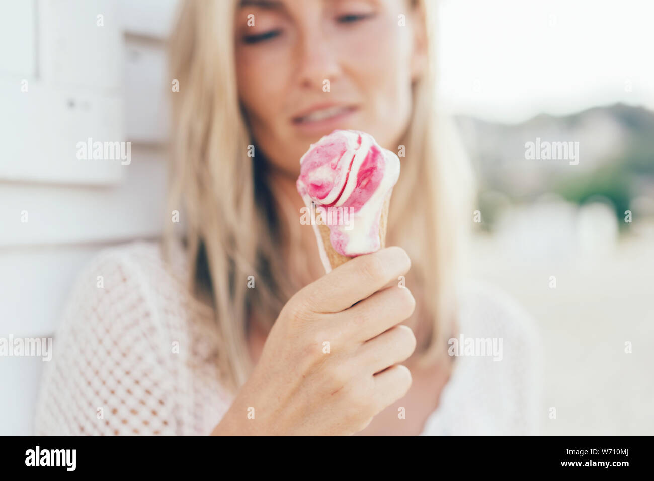Woman 30 Holds In Her Hands The Melting Strawberry Ice Cream In The