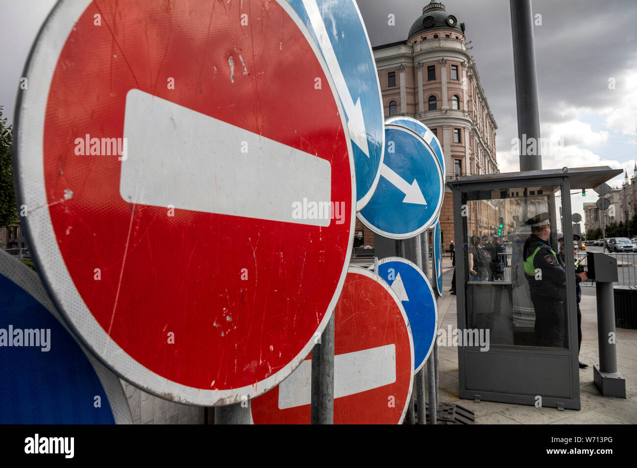 Road signs installed on a street in a center of a city Stock Photo - Alamy