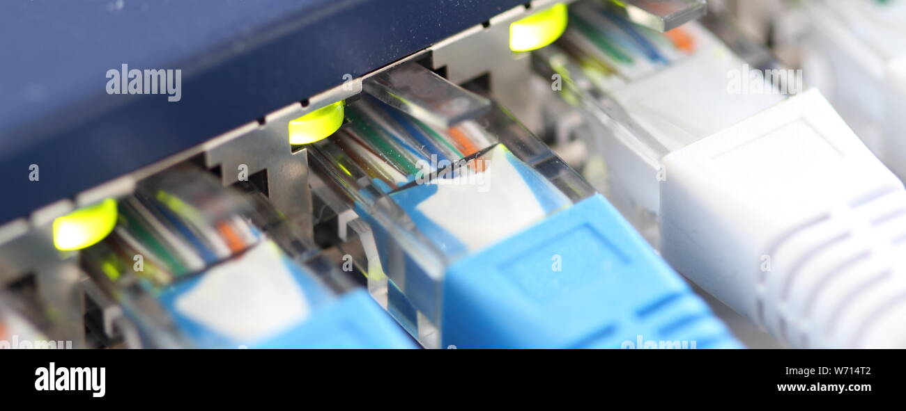 RJ45 plug in a router Stock Photo - Alamy