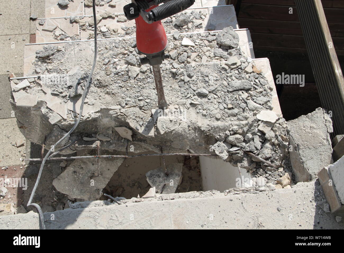 demolish an old staircase with a demolition hammer Stock Photo - Alamy