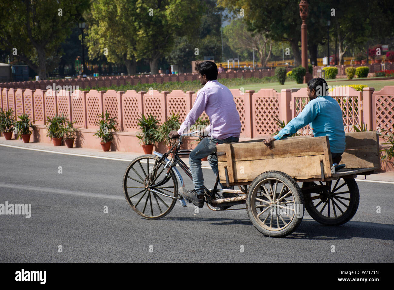 Indian and foreign people worker bike bicycle and use tricycle carrying ...