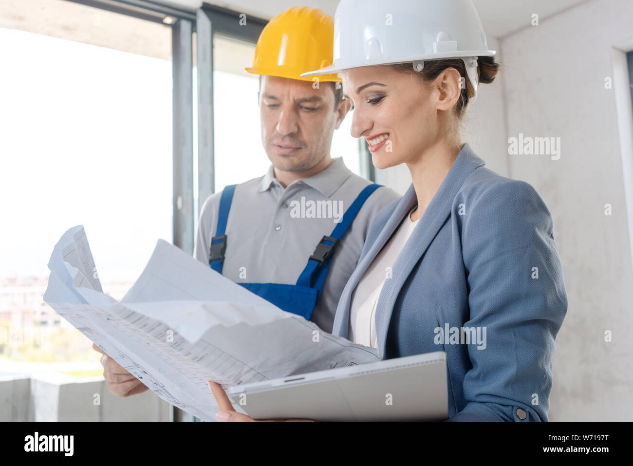 Project owner and construction worker during acceptance Stock Photo - Alamy