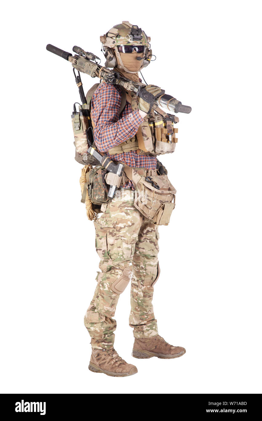 Strikeball enthusiast in checkered shirt wearing military ammunition ...