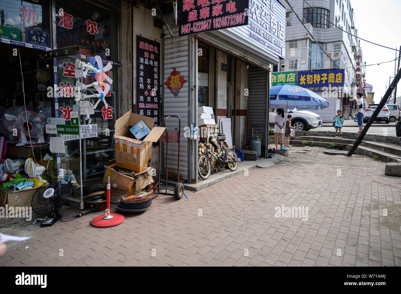 MISHAN, CHINA - JULY 27, 2019: People in commercial shopping street in ...