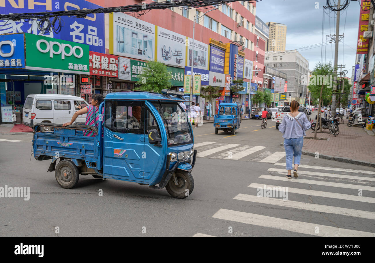 MISHAN, CHINA - JULY 27, 2019: Motorcycle-car (tricycle car) in the ...