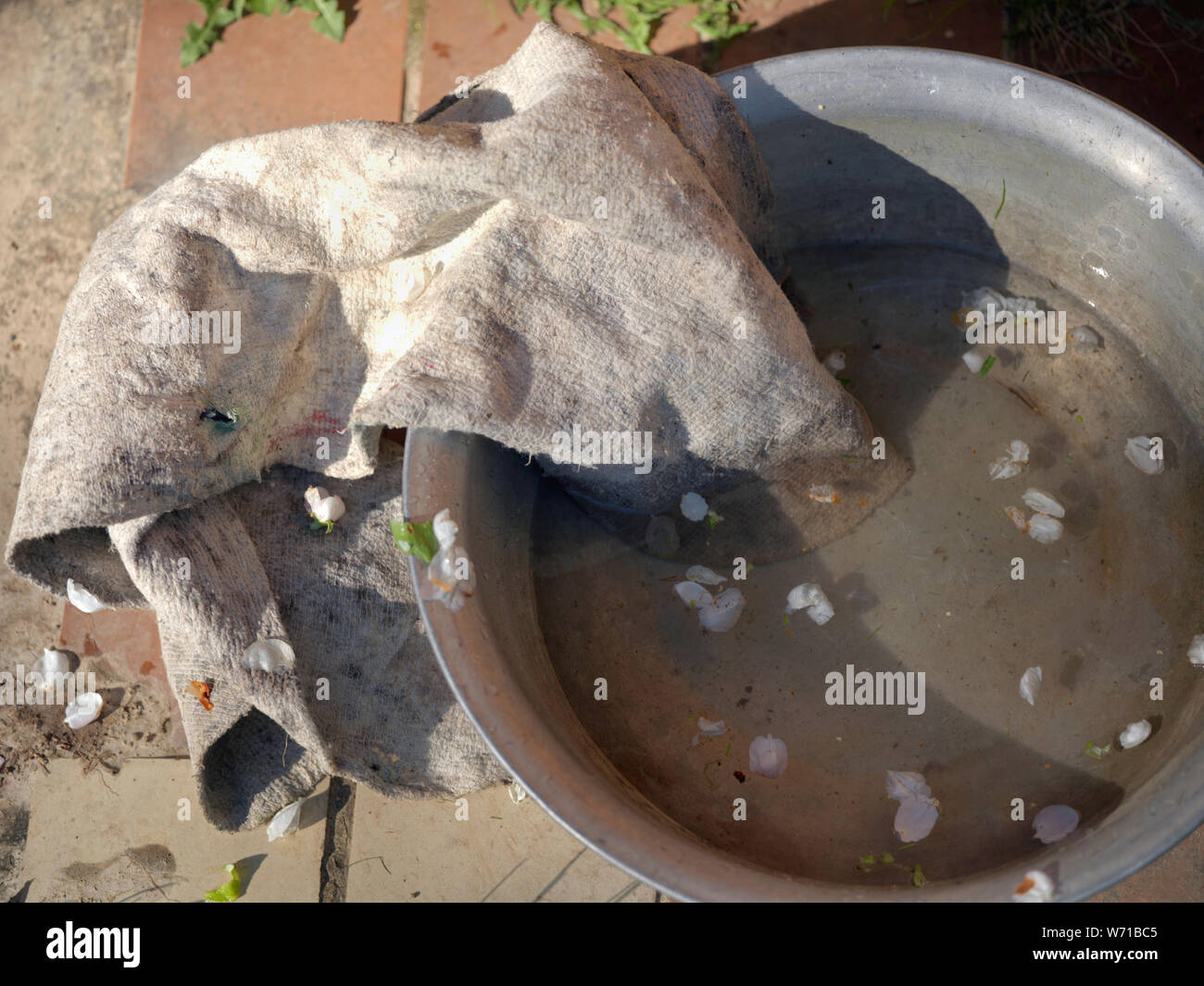 Overhead shot of a rag for washing floors in the basin with dirty water ...