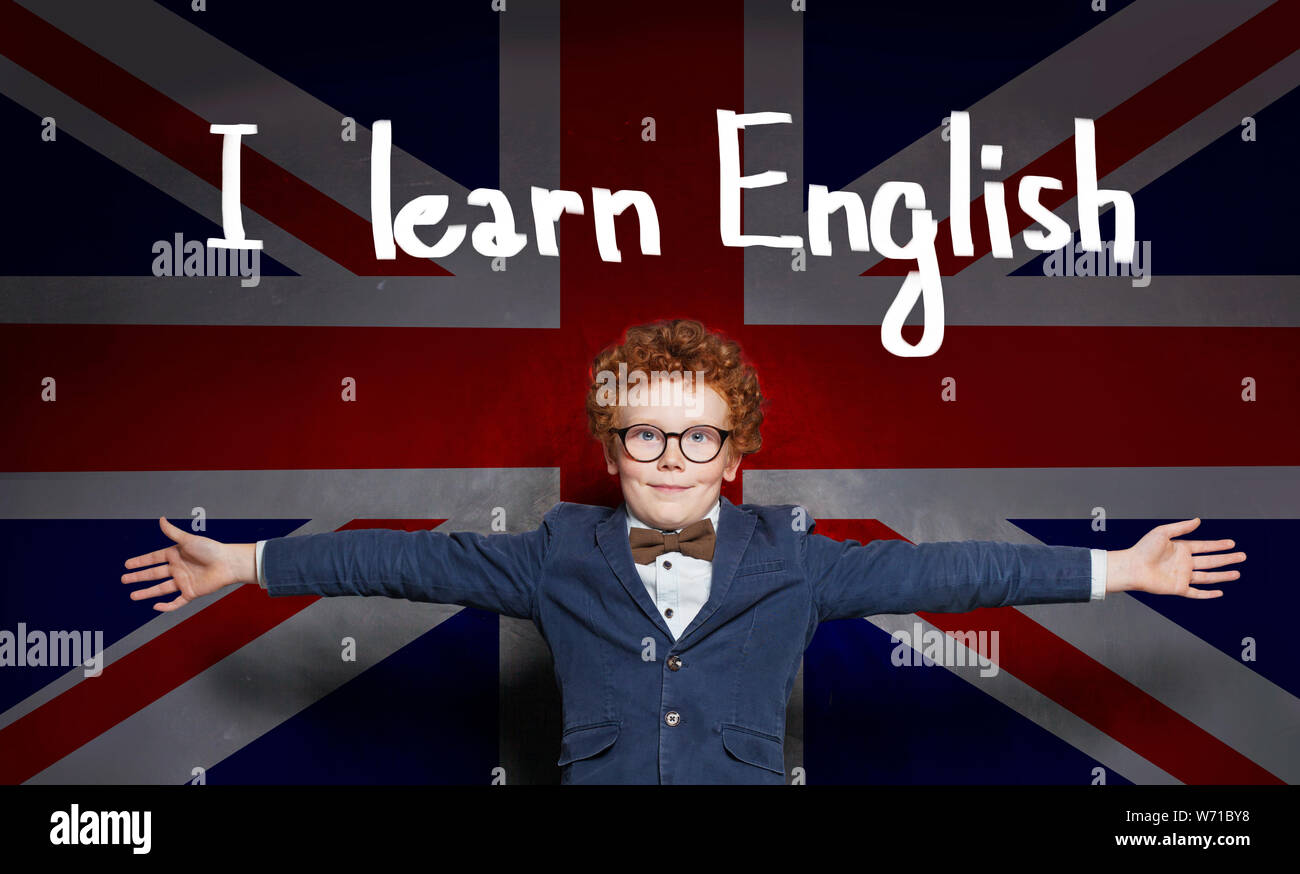 Cute kid in glasses on the UK flag background. Learn English concept ...