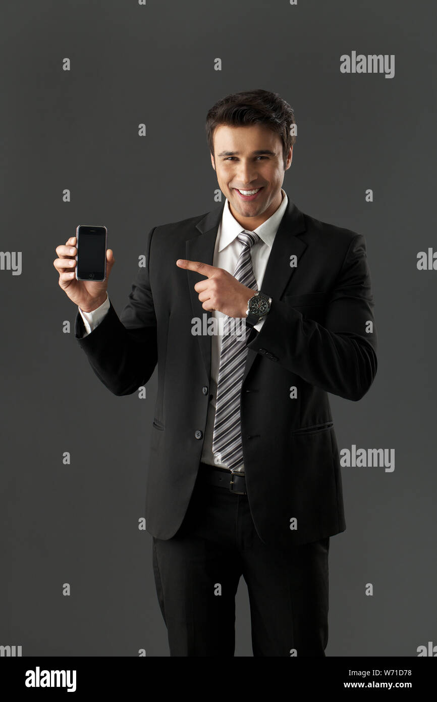 Salesman showing a smart phone Stock Photo - Alamy