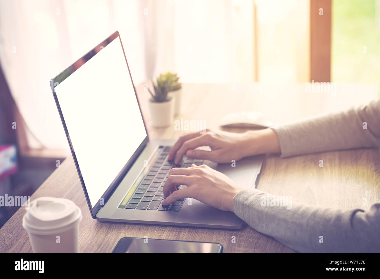 Business woman using laptop computer do online activity on wood table ...