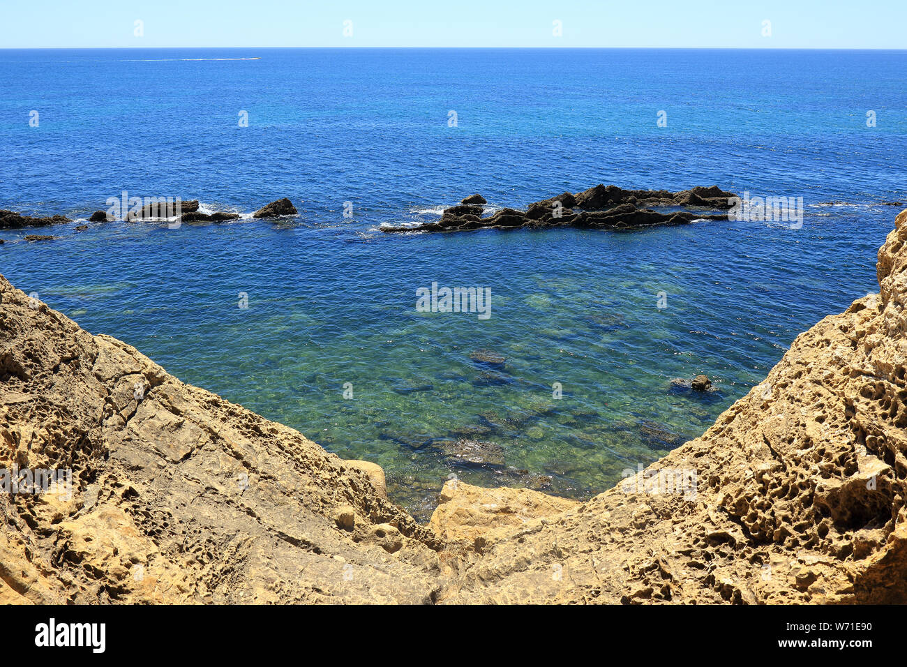The Atlantic Ocean viewed through a rocky frame Stock Photo - Alamy