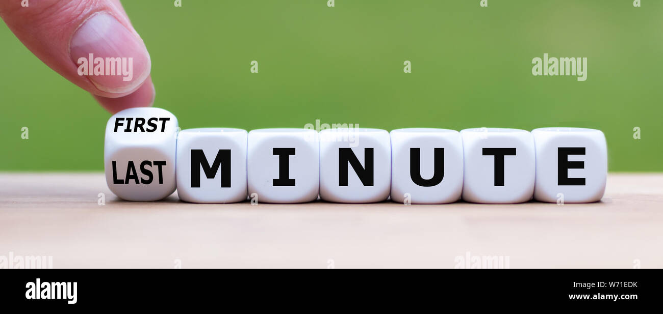 Hand turns a dice and changes the expression "first minute" to "last ...