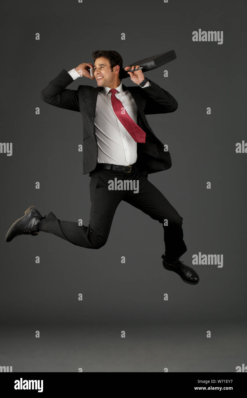 Man Mobile Phone Jumping Joy High Resolution Stock Photography and ...