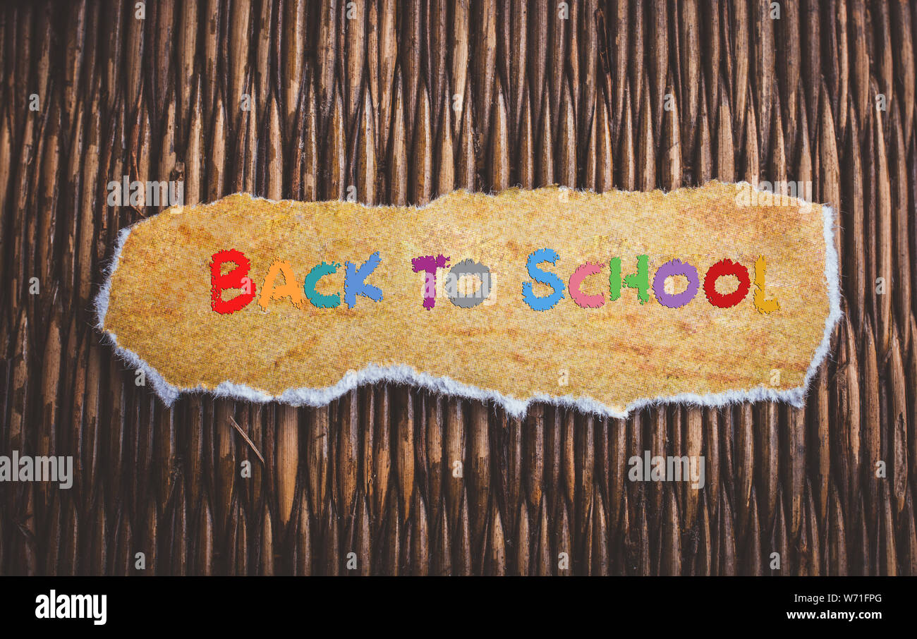 Back to school wording on a piece of torn paper Stock Photo - Alamy