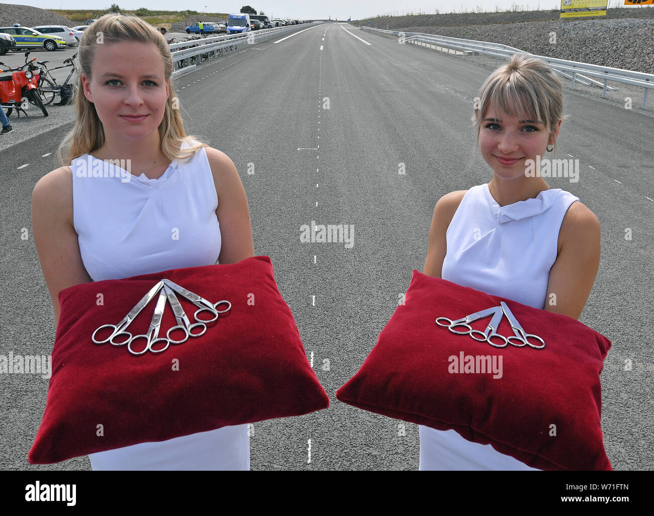 02 August 2019, Saxony, Borna: The hostesses Sarah Baumann and Eva ...