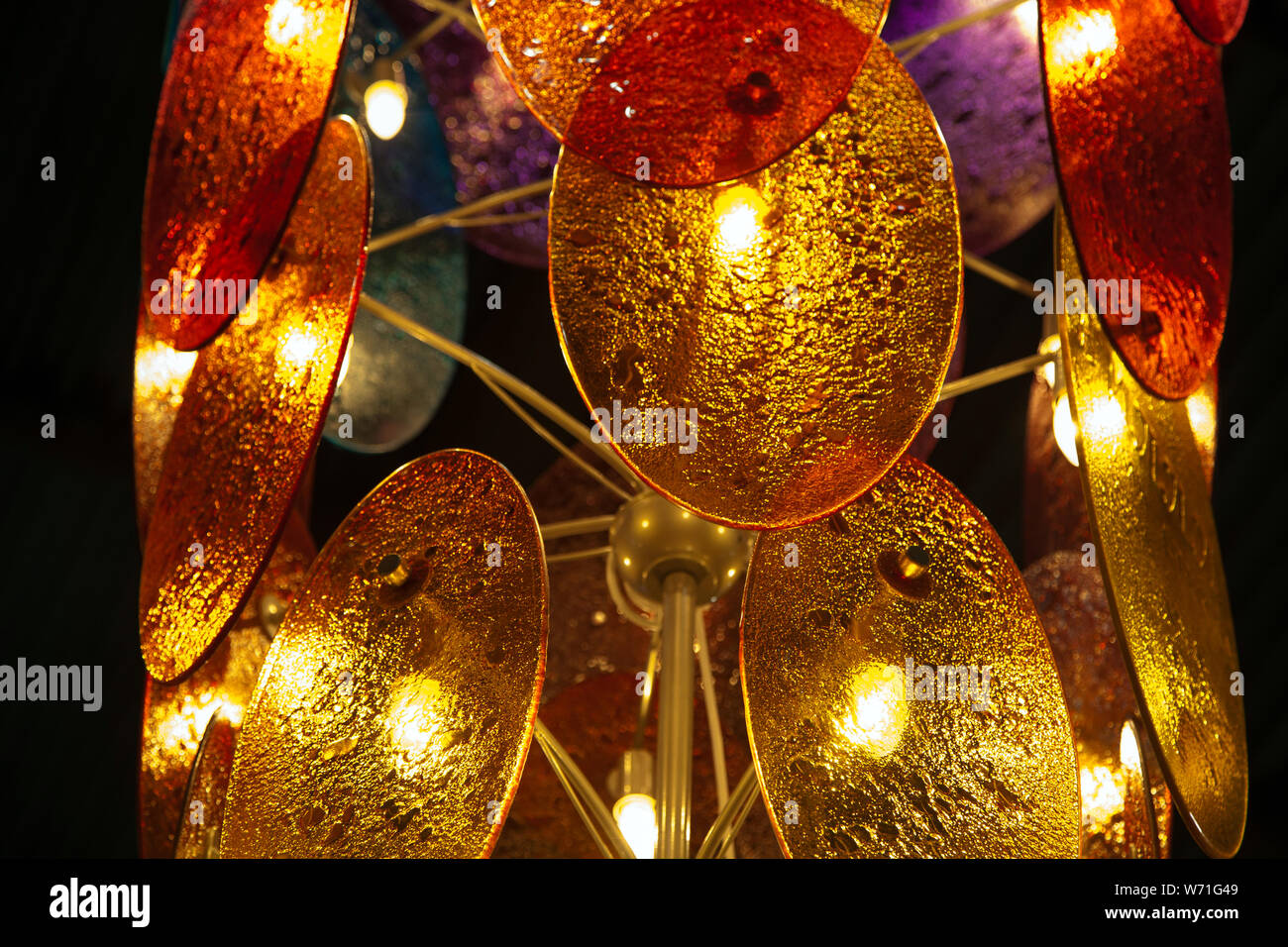 yellow and orange modern ceiling light fixture Stock Photo - Alamy