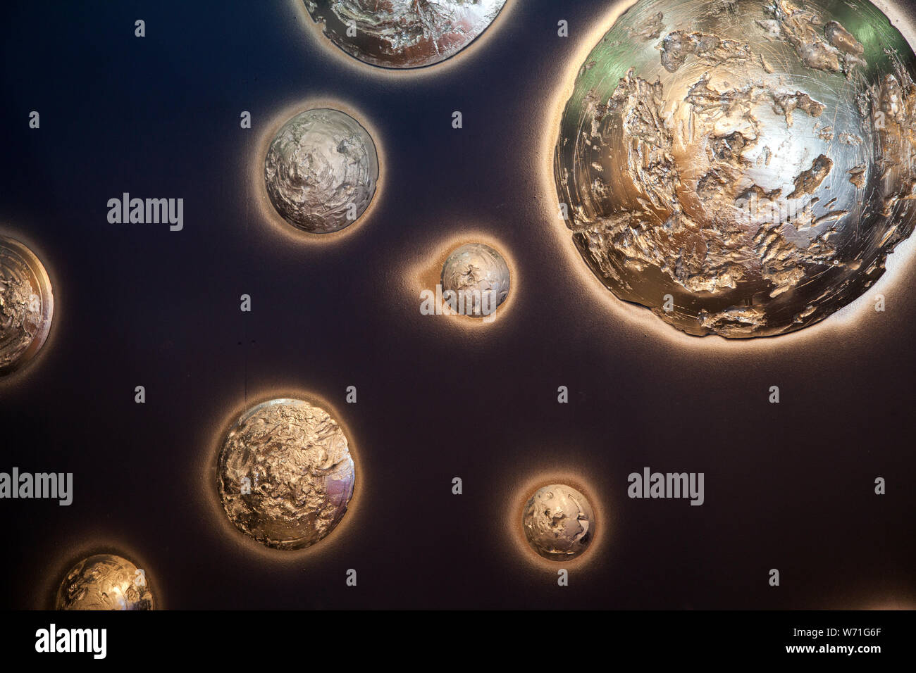 beautiful shiny decorative planets on blue wall background Stock Photo ...