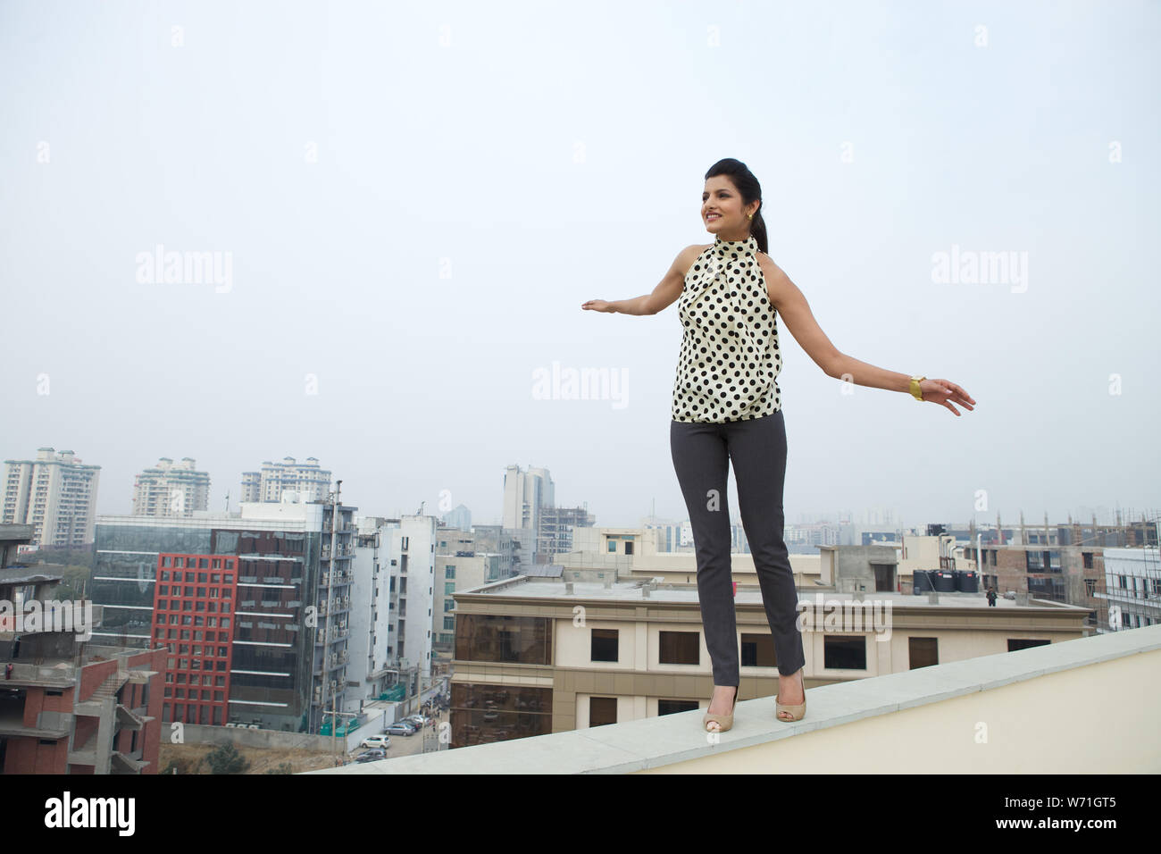 Businessman balancing office building on hi-res stock photography and ...