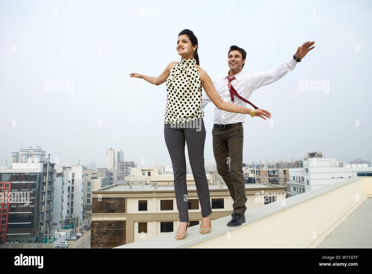 Businessman balancing office building on hi-res stock photography and ...