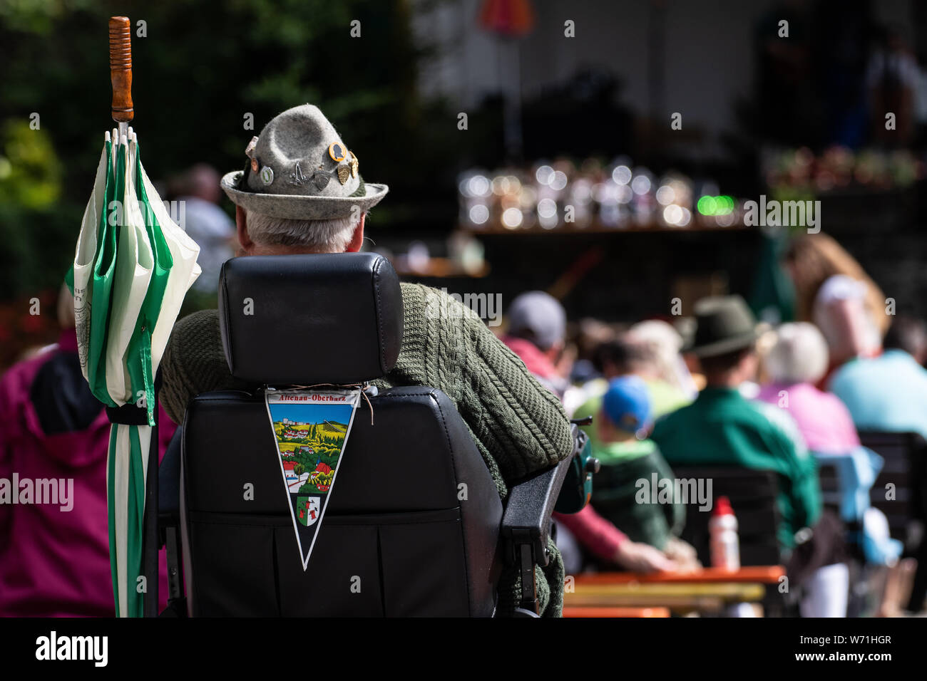 Clausthal Zellerfeld, Germany. 04th Aug, 2019. A visitor sits in his ...