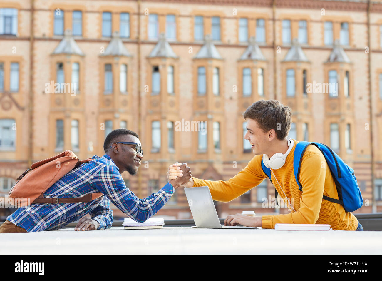 Two students shaking hands on hi-res stock photography and images - Alamy