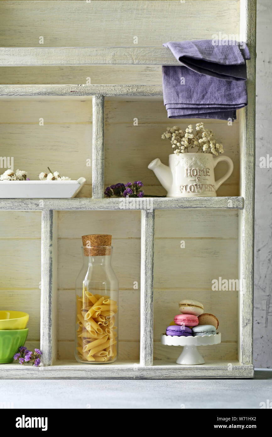 kitchen wooden white cupboard background with utensils and food Stock ...