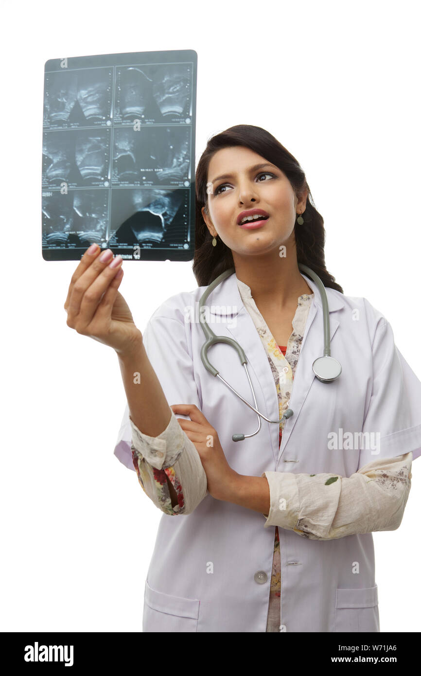 Indian doctor holding up x ray hi-res stock photography and images - Alamy