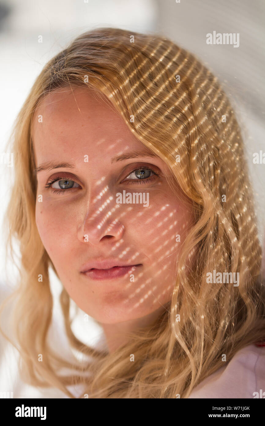 closeup of woman face with light and shadow pattern Stock Photo - Alamy