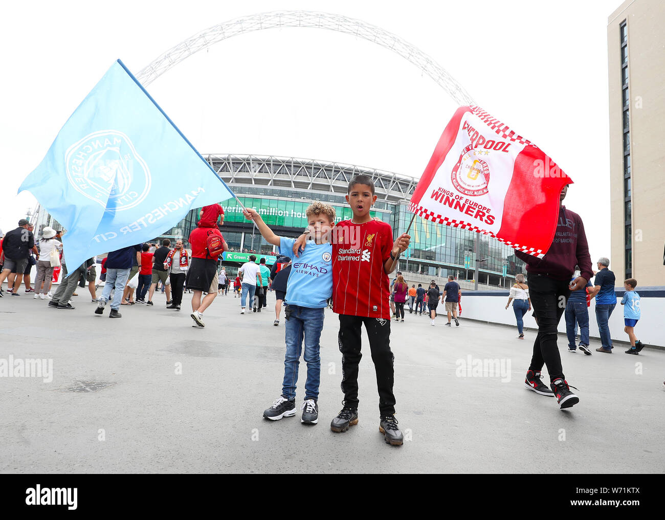 Liverpool fan Shay Sanderson (right) and Manchester City fan Kyron ...