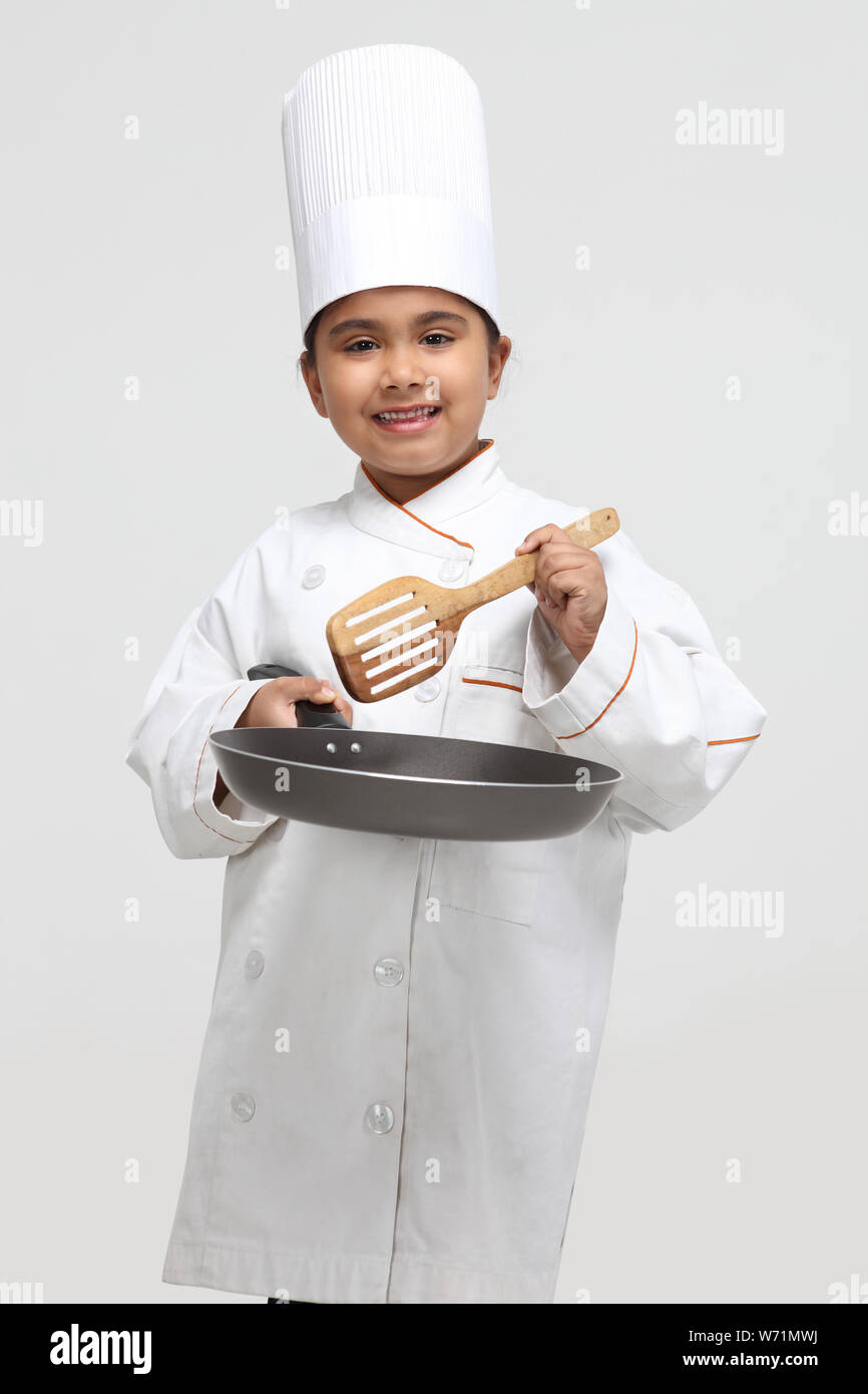 Child chef preparing food Stock Photo - Alamy