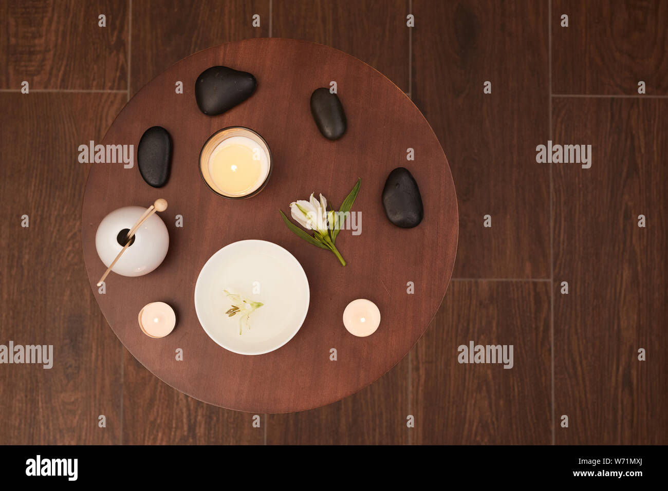 Above view background of round wooden table set for aromatherapy in SPA ...