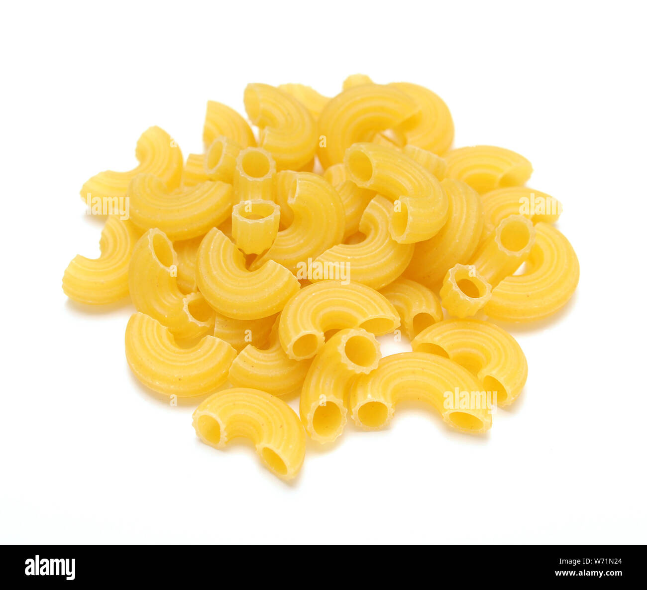 a pile of tube pasta on white background Stock Photo - Alamy