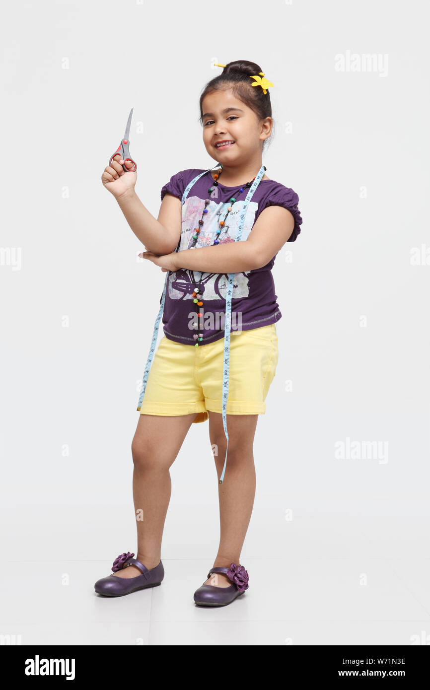 Girl dressed up as a fashion designer Stock Photo - Alamy