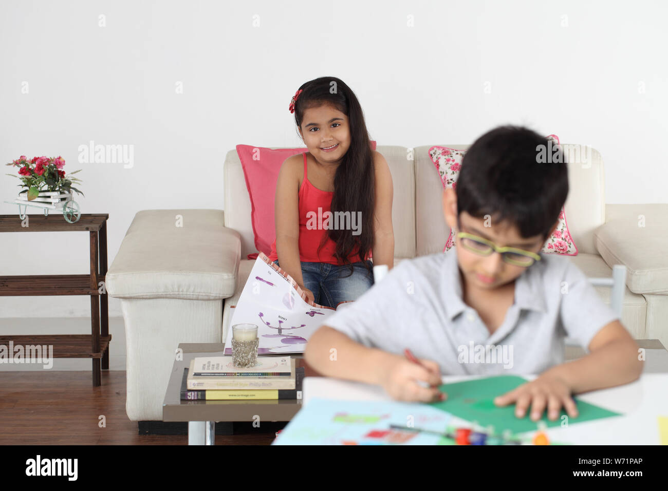 Children doing their homework at home Stock Photo - Alamy
