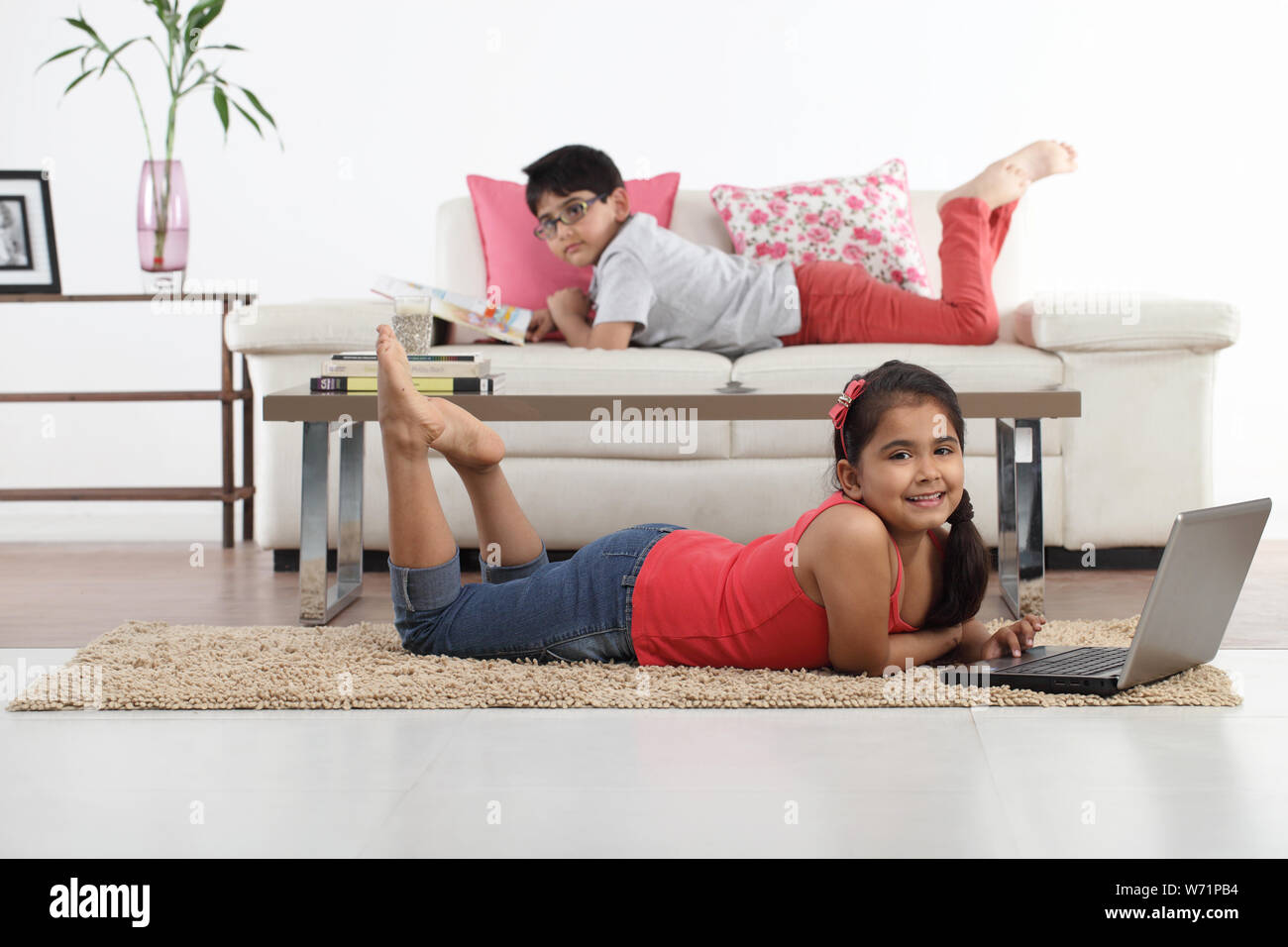 Children studying at home Stock Photo - Alamy