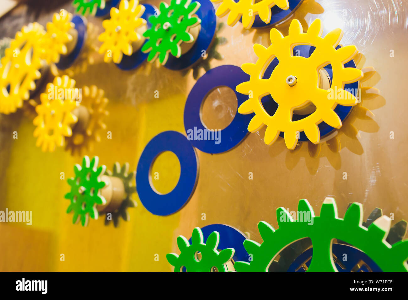 mechanism of multi-colored gears, assembled puzzle. Business concept ...