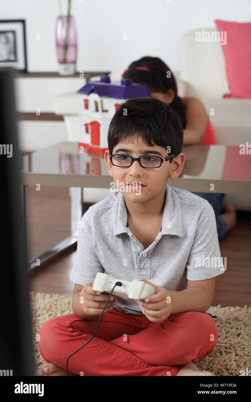 Boy playing video game Stock Photo - Alamy