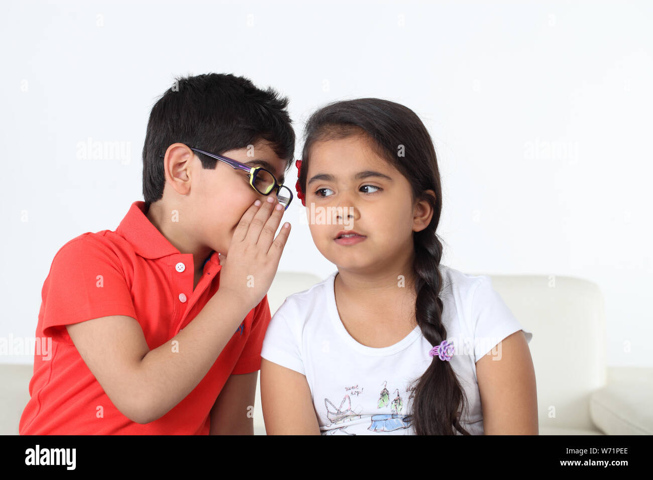 Whispering small girls hi-res stock photography and images - Alamy