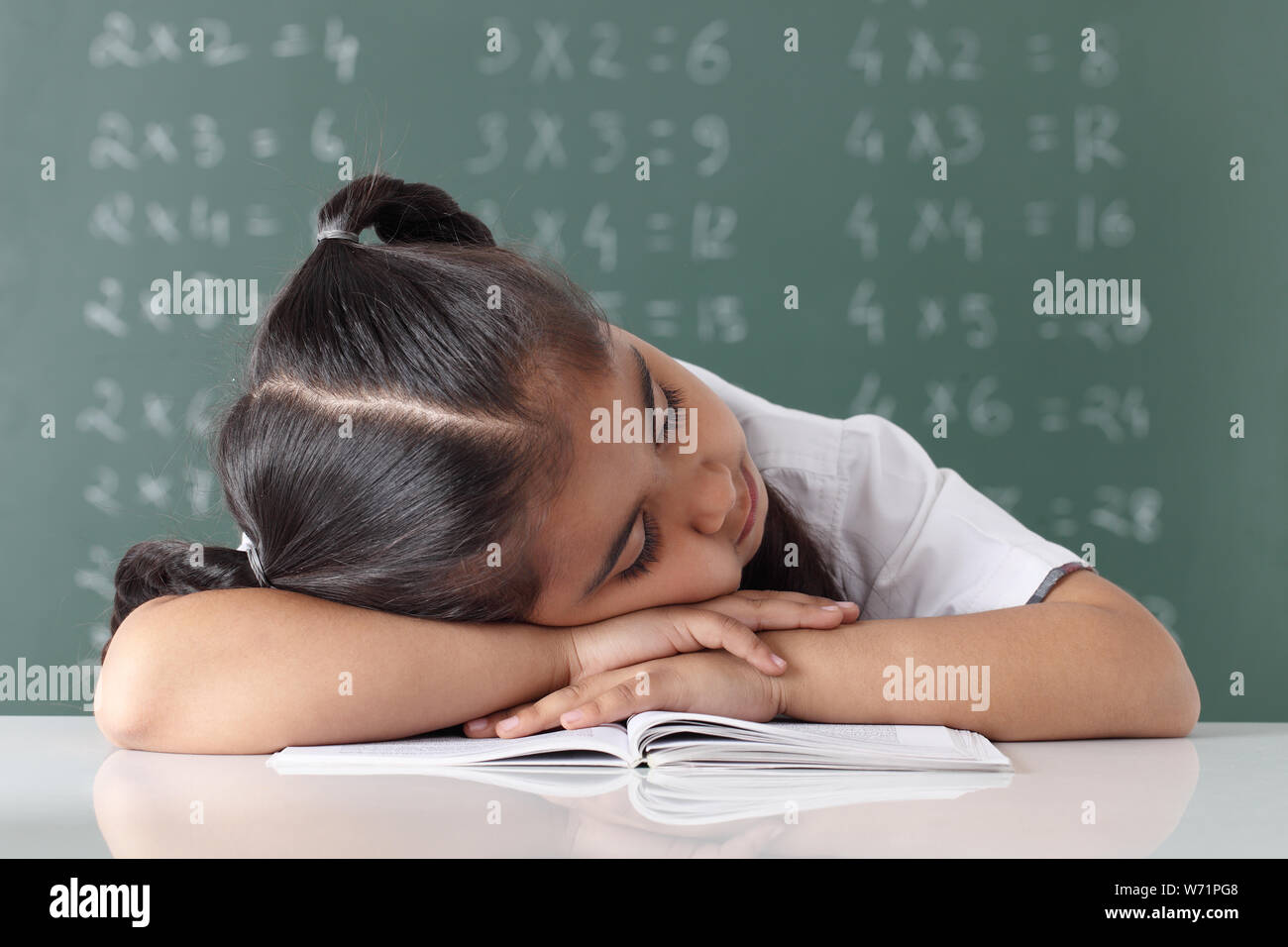 School girl sleeping in classroom hi-res stock photography and images - Alamy