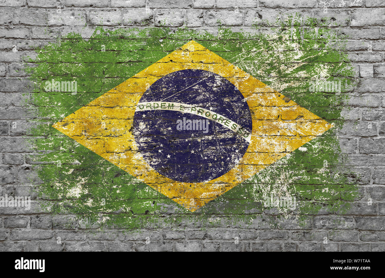 Grunge distressed flag of Brazil painted on old weathered grey brick ...