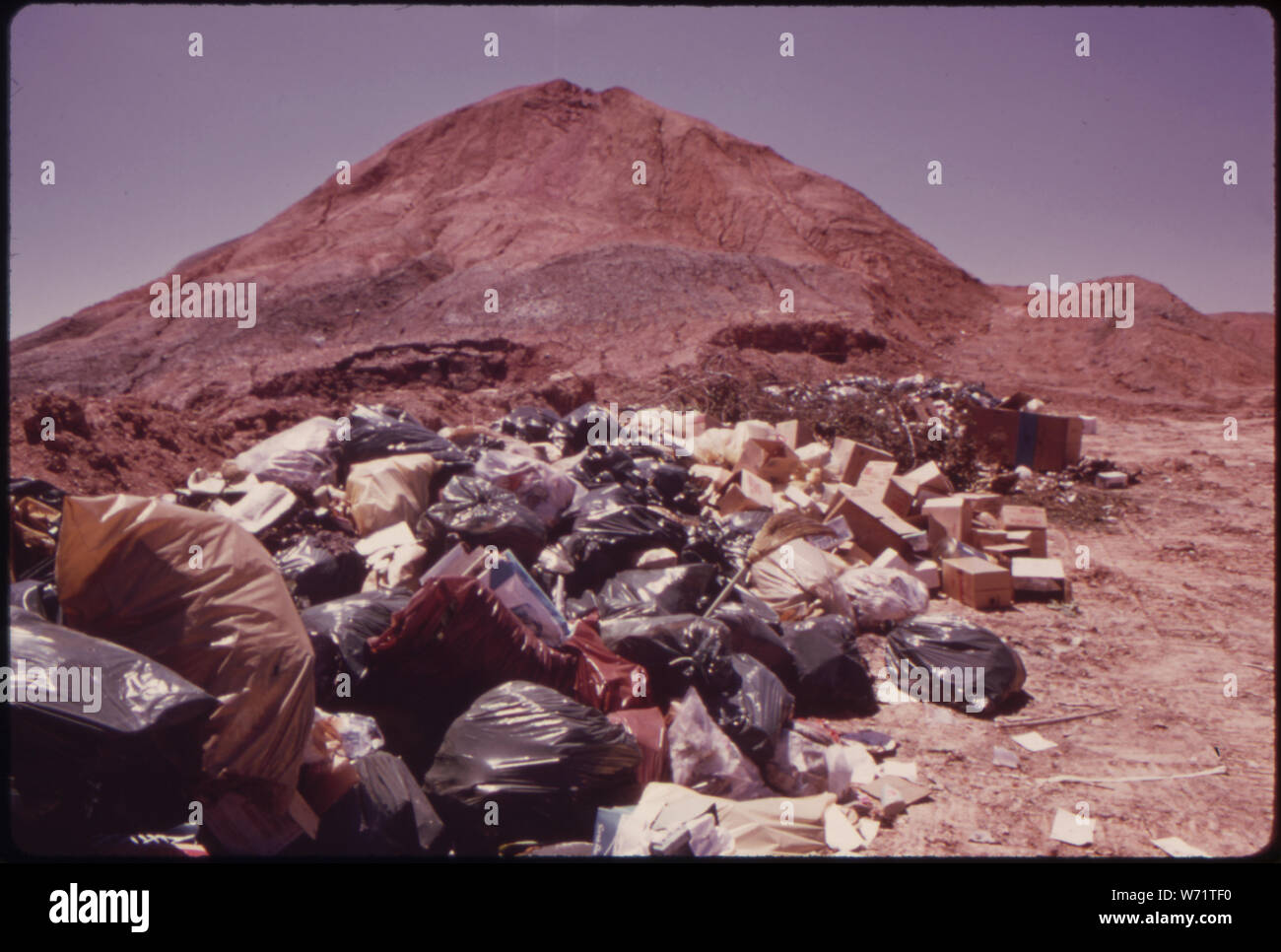 ABANDONED MINE IN LADD IS USED AS CITY DUMP. THE GARBAGE IS COVERED ...