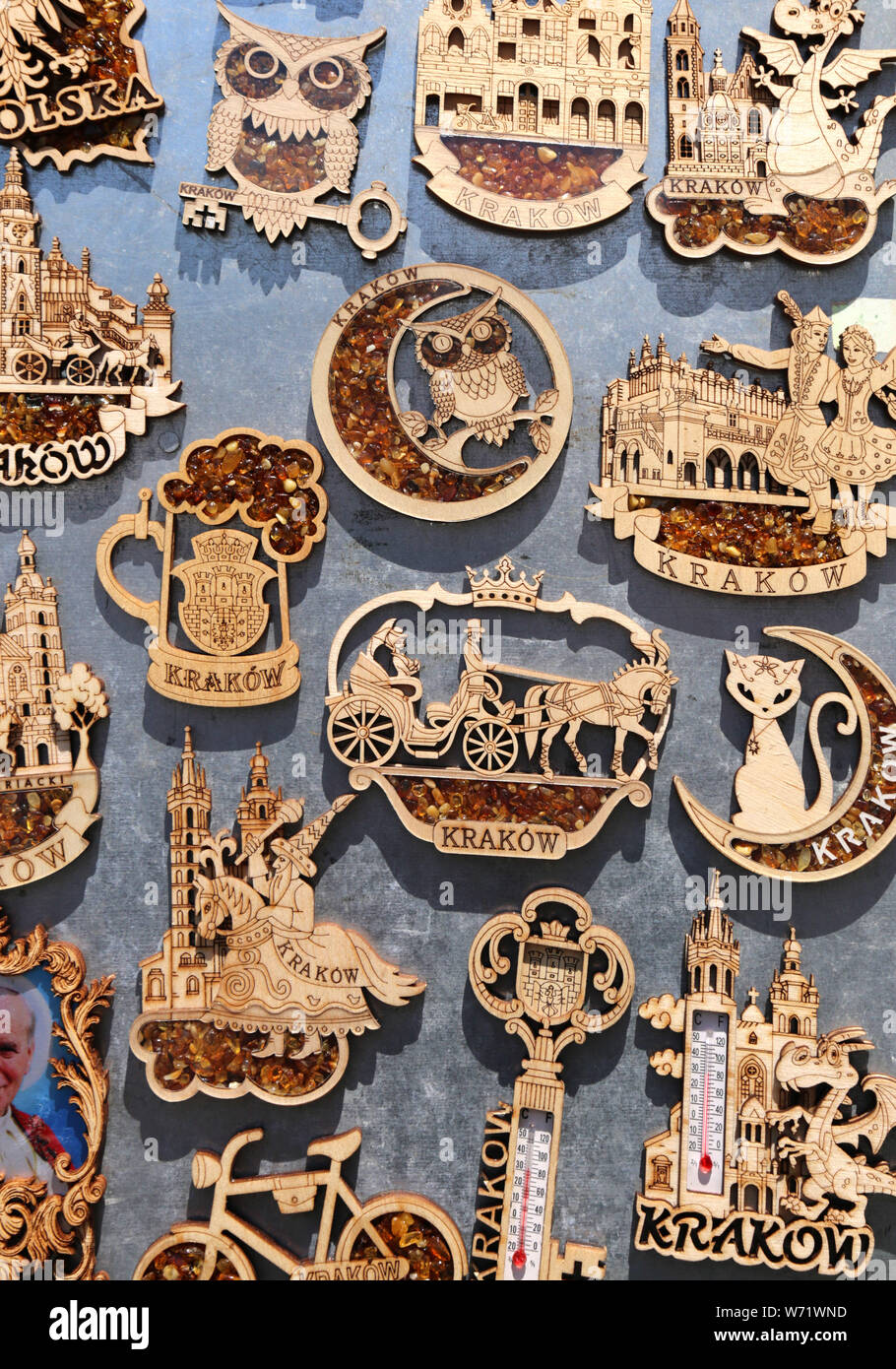 Cracow. Poland. Magnet souvenirs of Cracow made of cut wood and amber ...