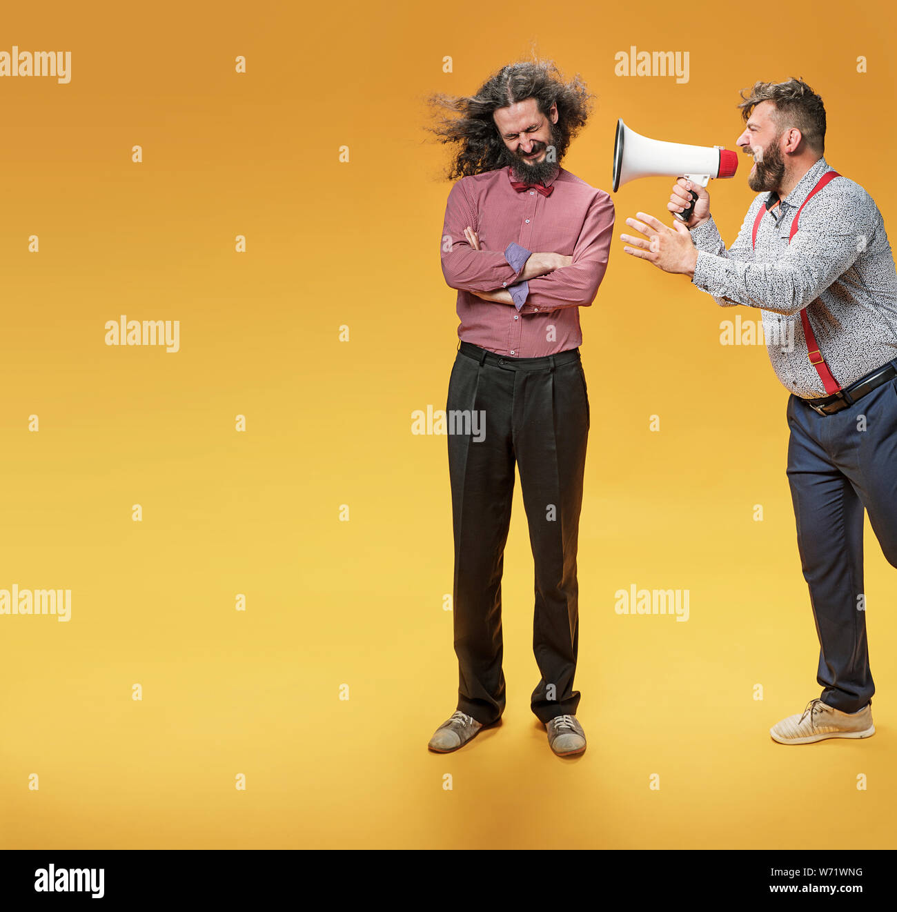 Angry boss yelling at his employee with a megaphone Stock Photo - Alamy