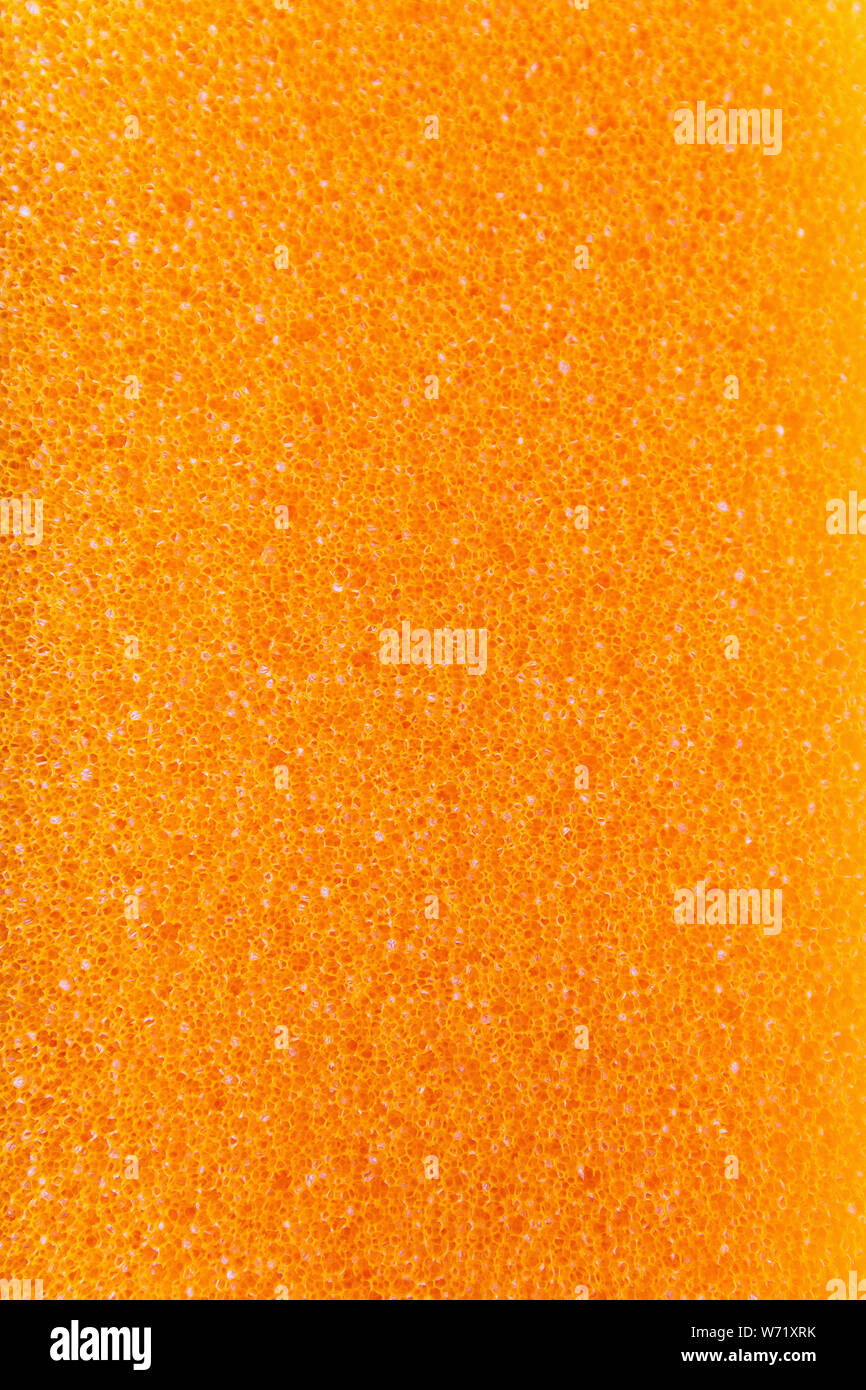 Orange foam rubber texture background Stock Photo - Alamy