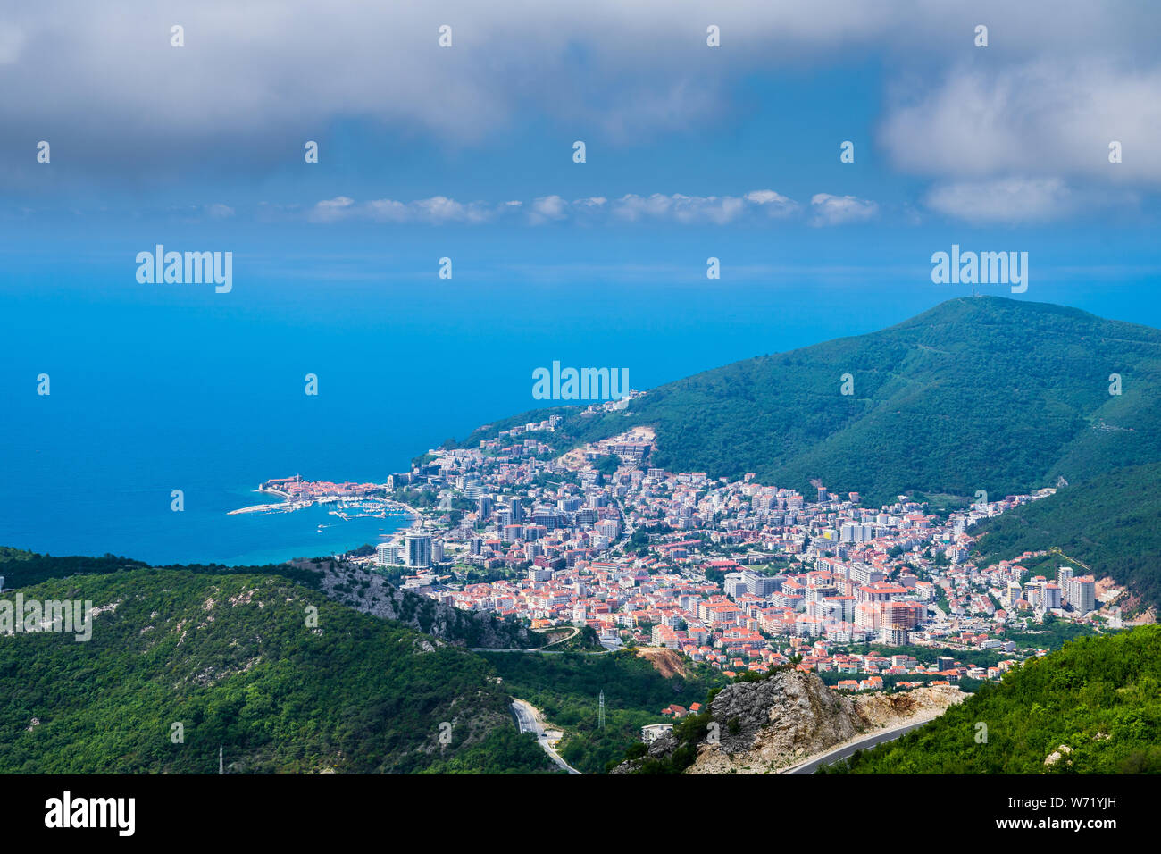 Montenegro, Wide view above old town of budva and modern city buildings ...