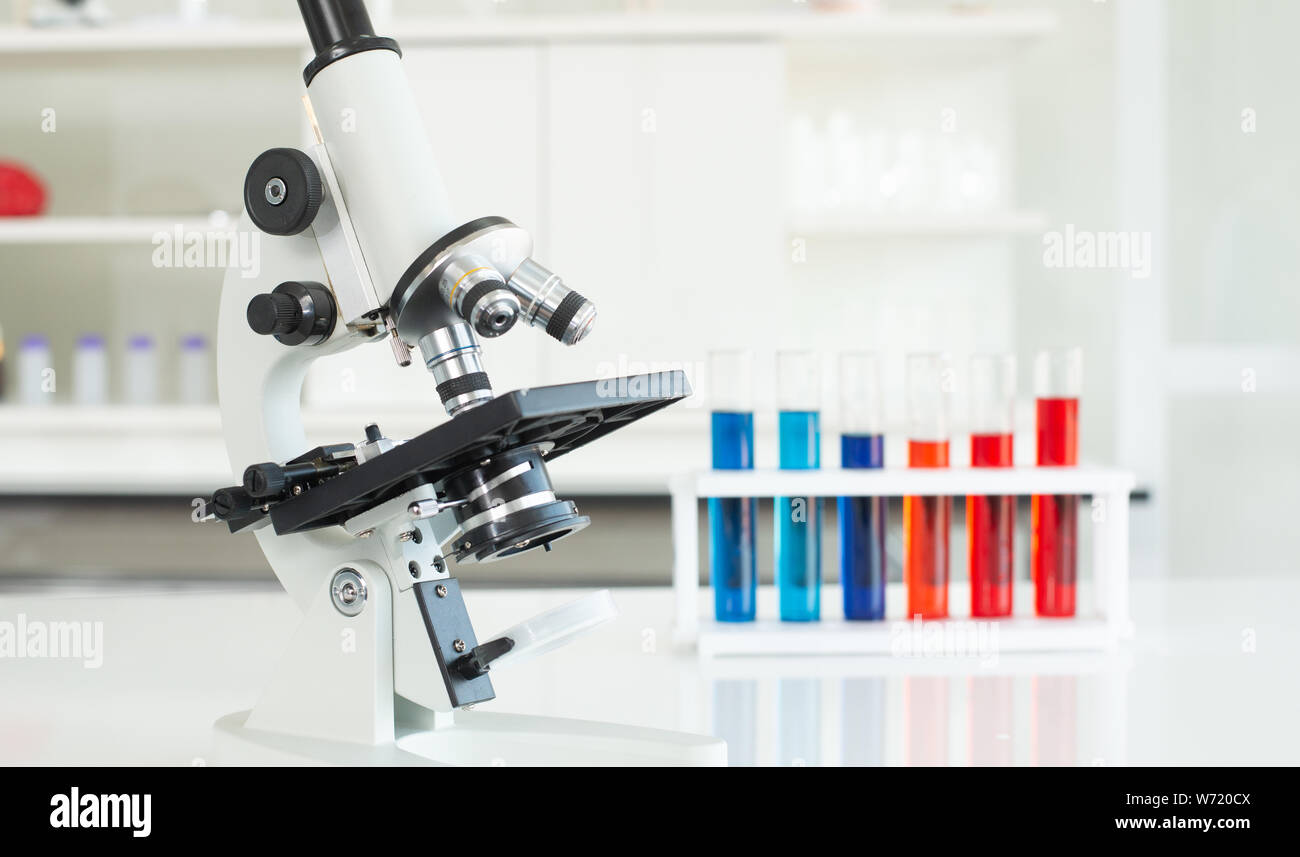 Microscope with chemical glass tube in laboratory concept Stock Photo ...