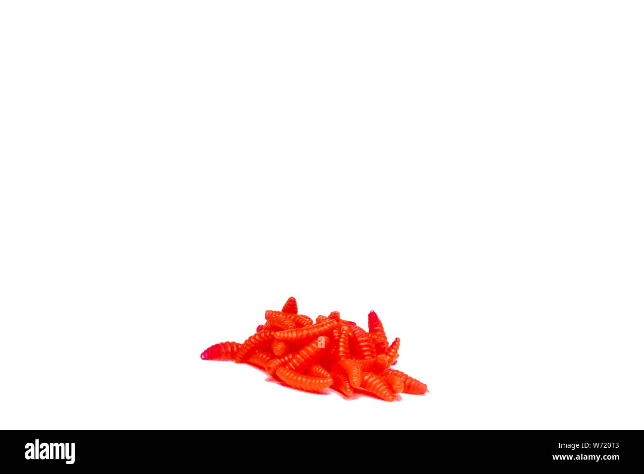 Red Artificial fishing larvae of insects on white background with soft ...